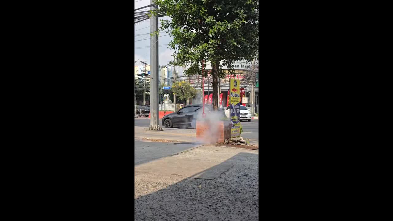 Locals light a string of firecrackers hanging from a tree for Lunar New ...