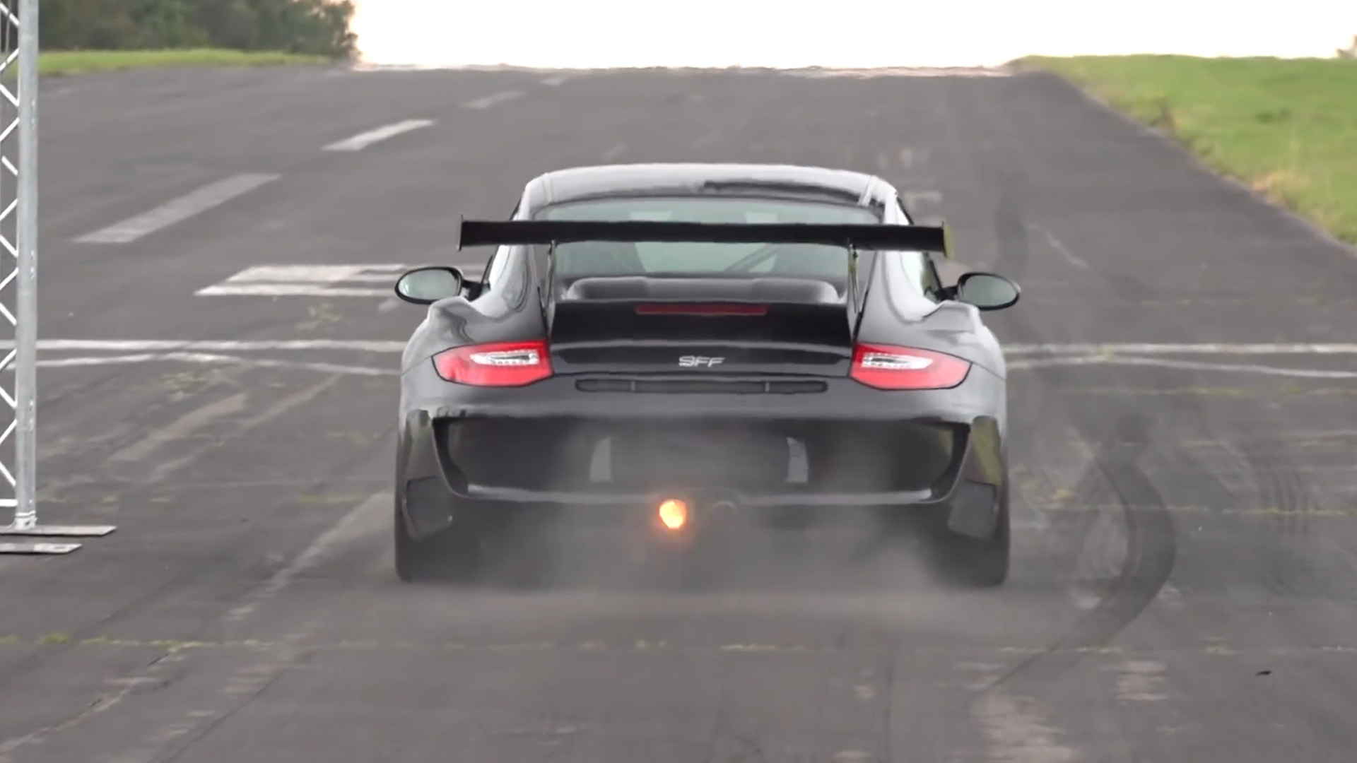 Big power Porsche 911 accelerates with fire bursts