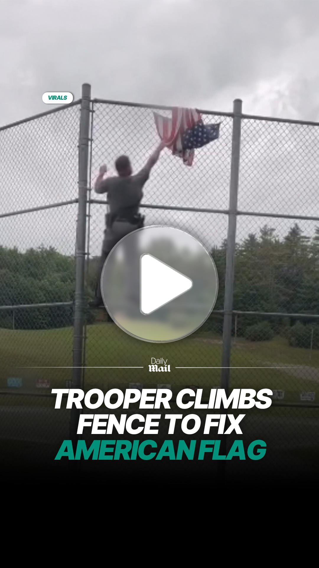 State trooper climbs fence to fix American flag