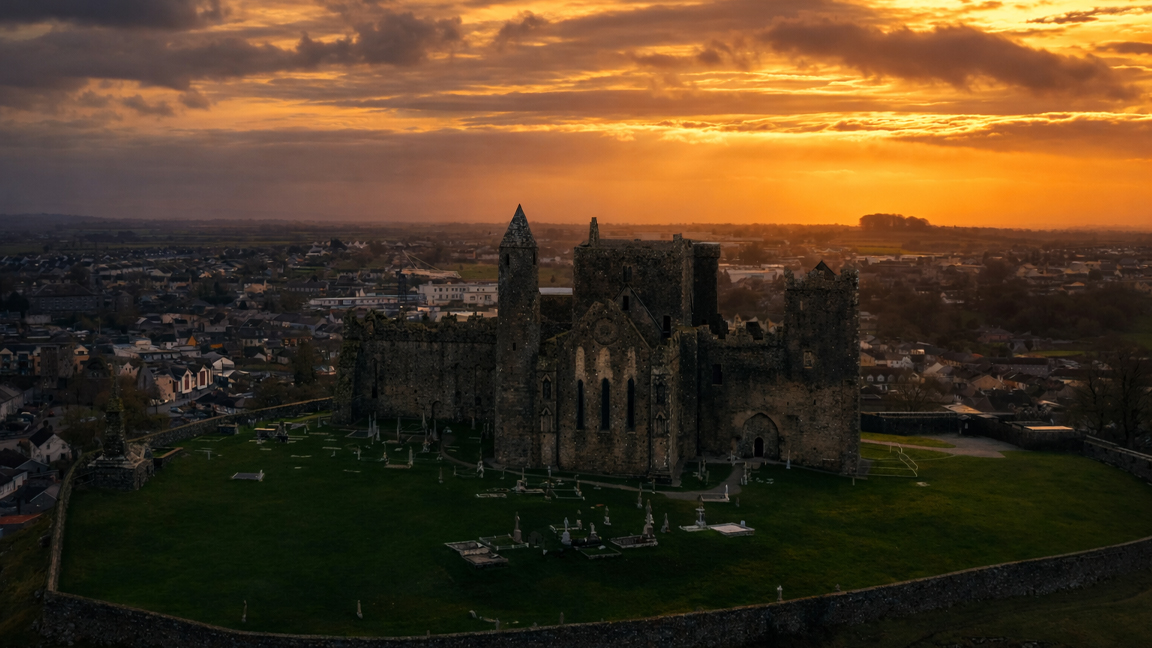 Historic castle at sunset over the town