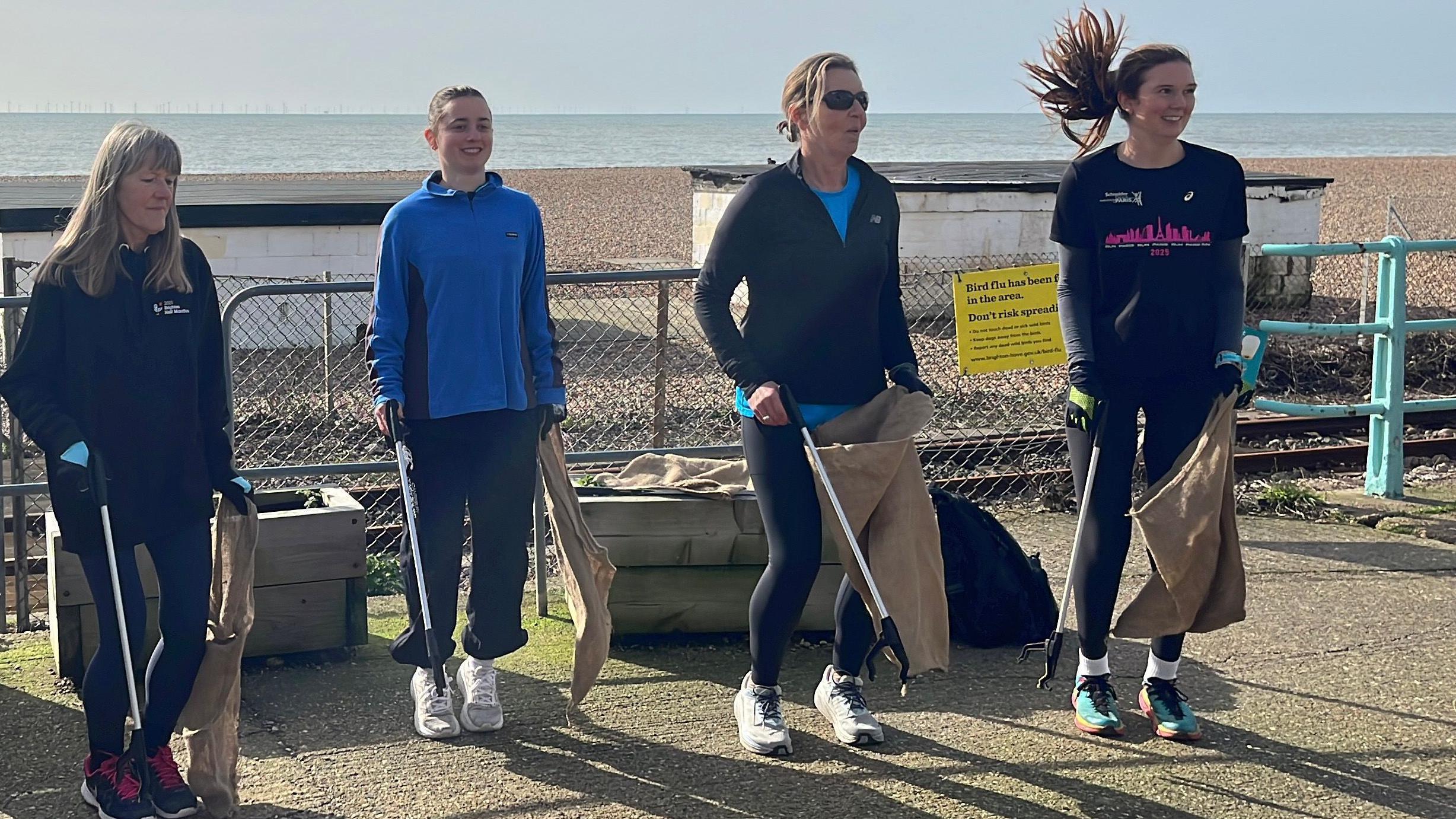 The marathon runners picking up litter as they go