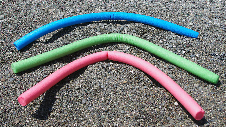 Painting doors is easier (and less messy) thanks to this pool noodle hack