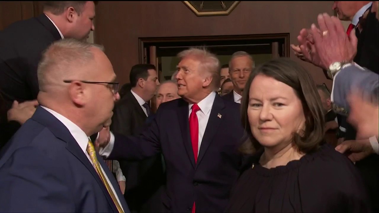 President Donald Trump enters the House chambers