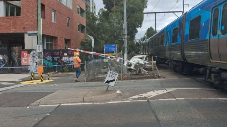 Train line suspended after car struck at Melbourne level crossing