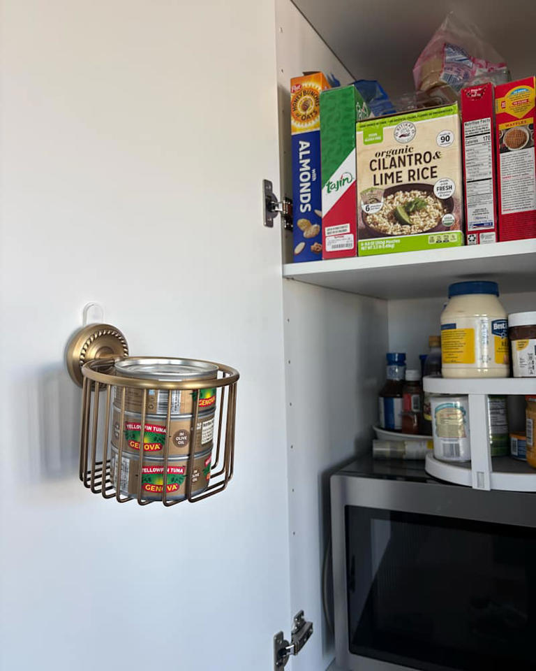 I put a toilet paper holder inside my kitchen cabinet, and it actually ...