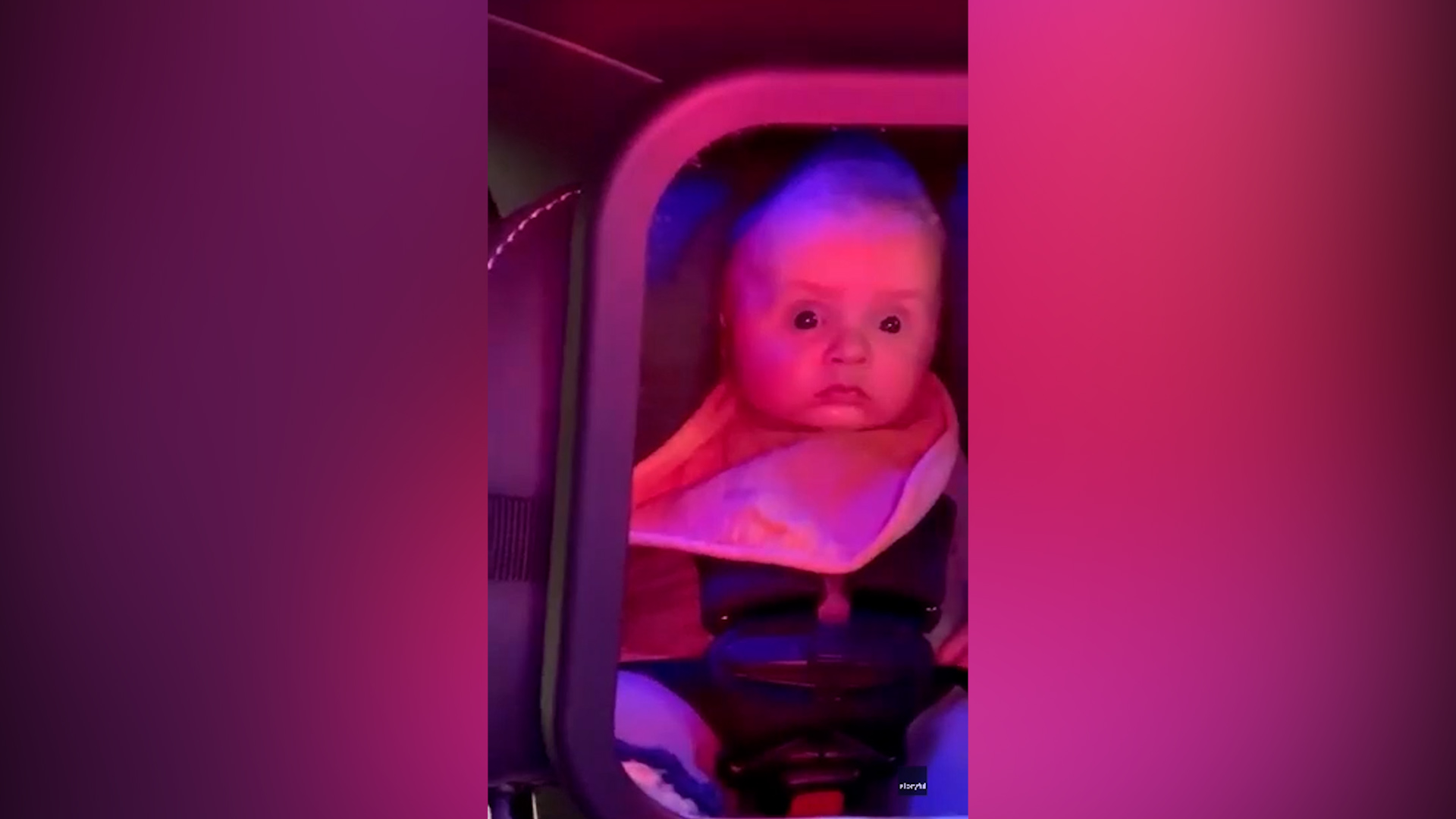 Baby looks stunned during her first drive-thru car wash