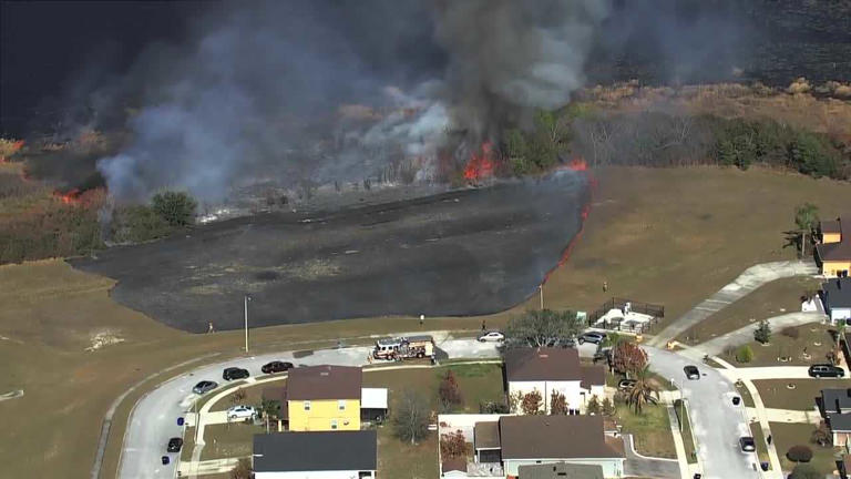 1.5-acre brush fire burns near homes in Orange County subdivision