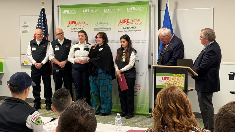 Woman reunites with paramedics who saved her life