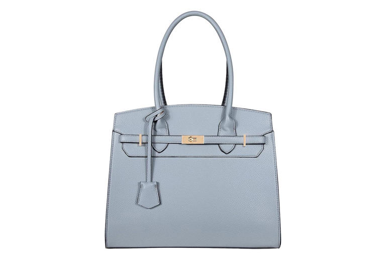 This quilted bag looks like it belongs behind glass in a Chanel ...