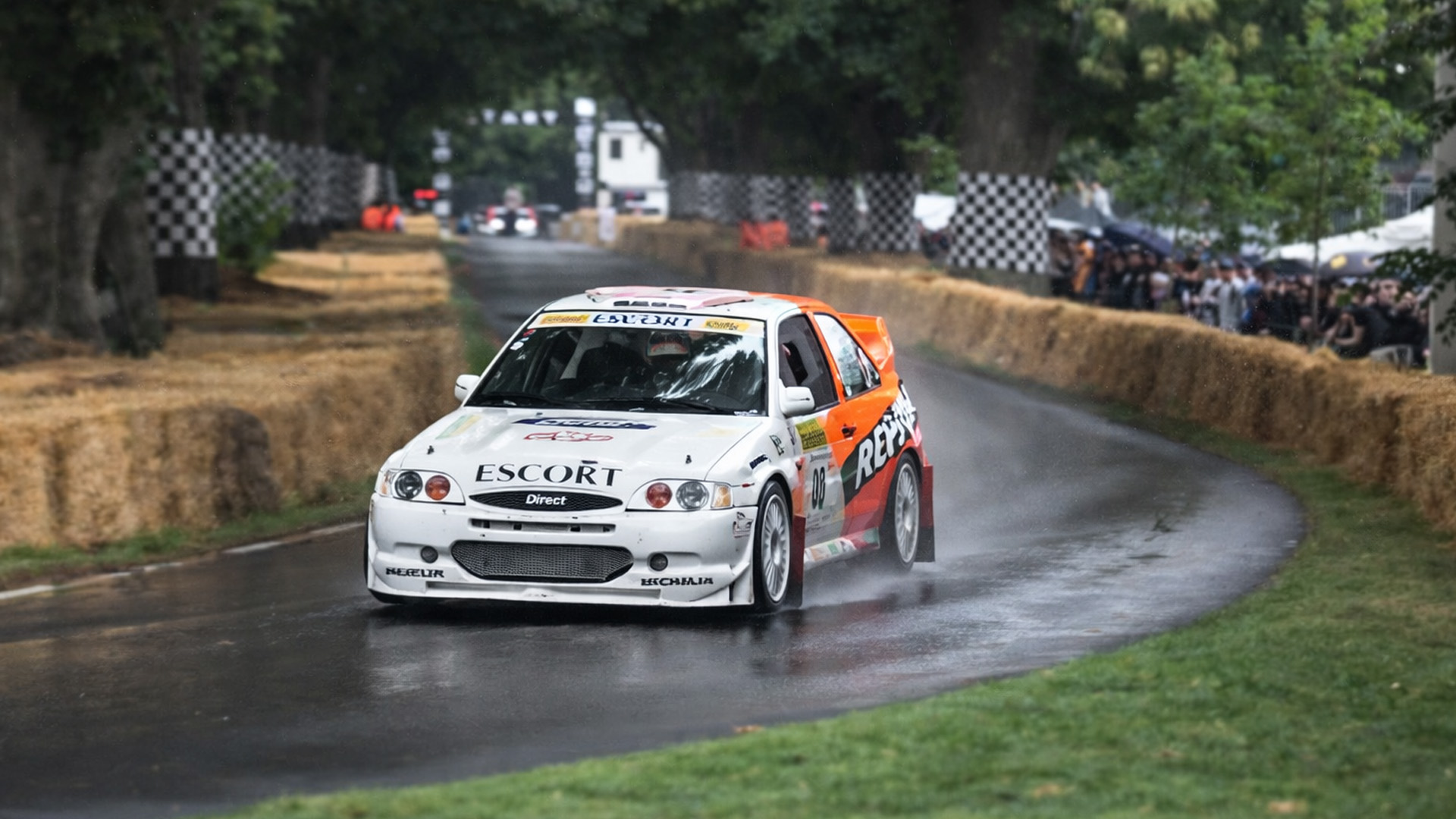Ford Escort rally car wild slide on slippery track