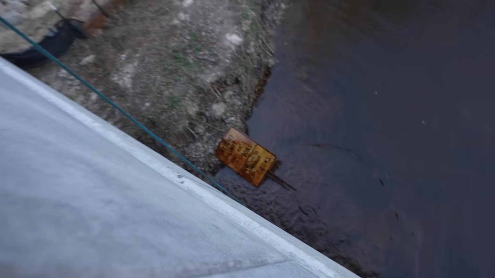 Magnet fishing an abandoned bridge - box cutter, lighter, and a knife find