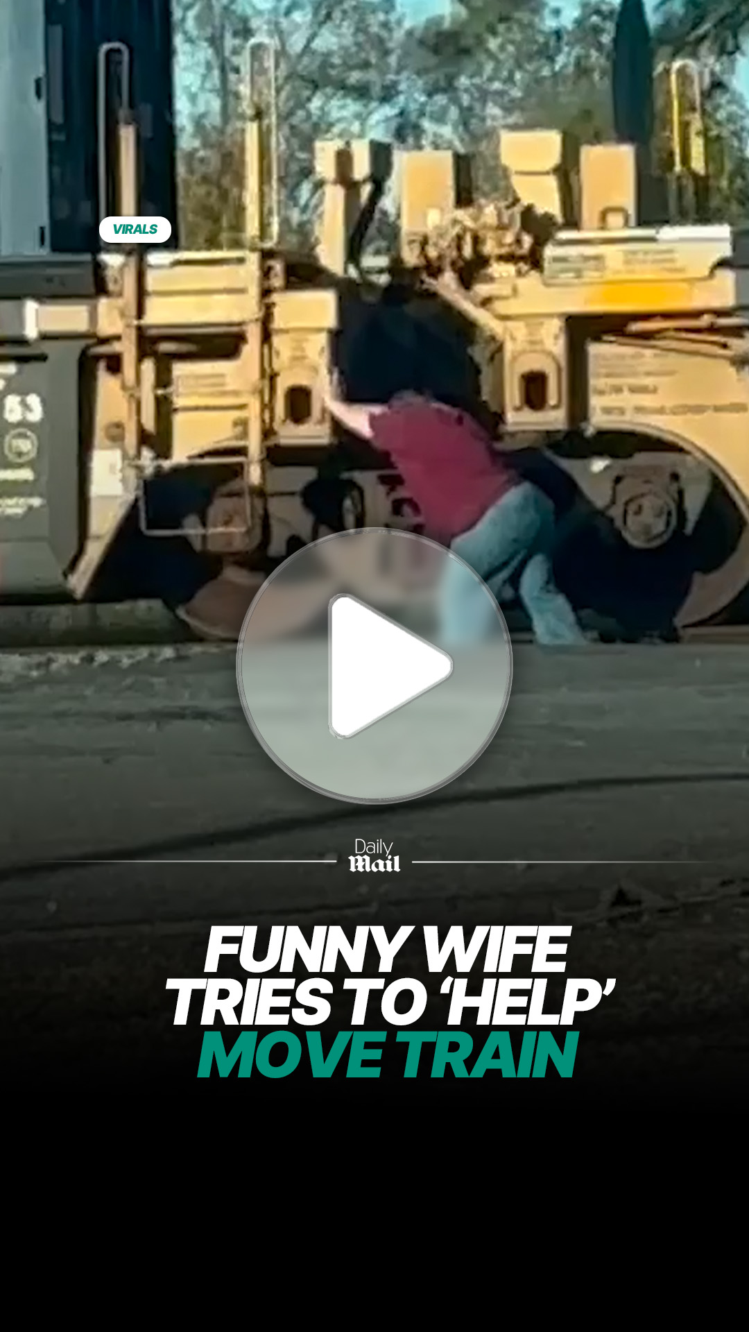 Woman jokingly attempts to push train in lighthearted moment