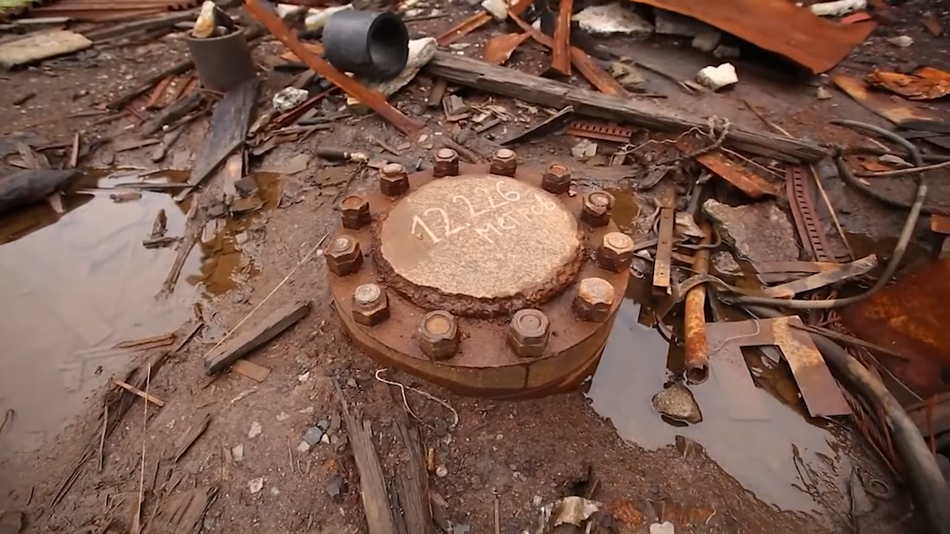 Behind this cover is the deepest hole humans ever dug
