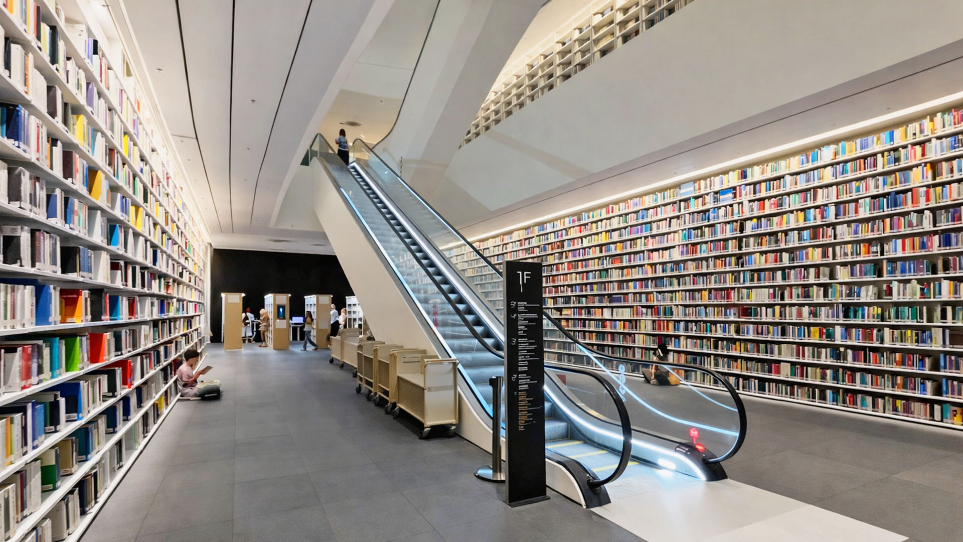 Escalator between massive bookshelves in China library