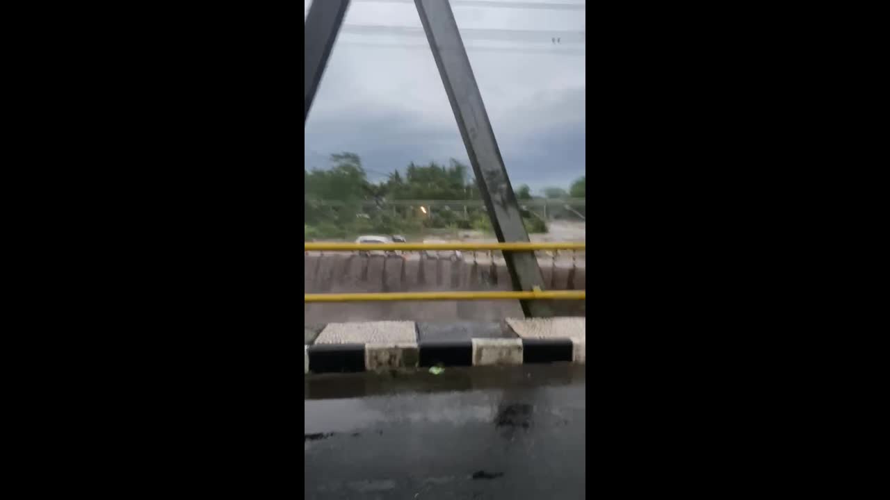 Flooded road leaves cars stranded in Magelang, Java, Indonesia