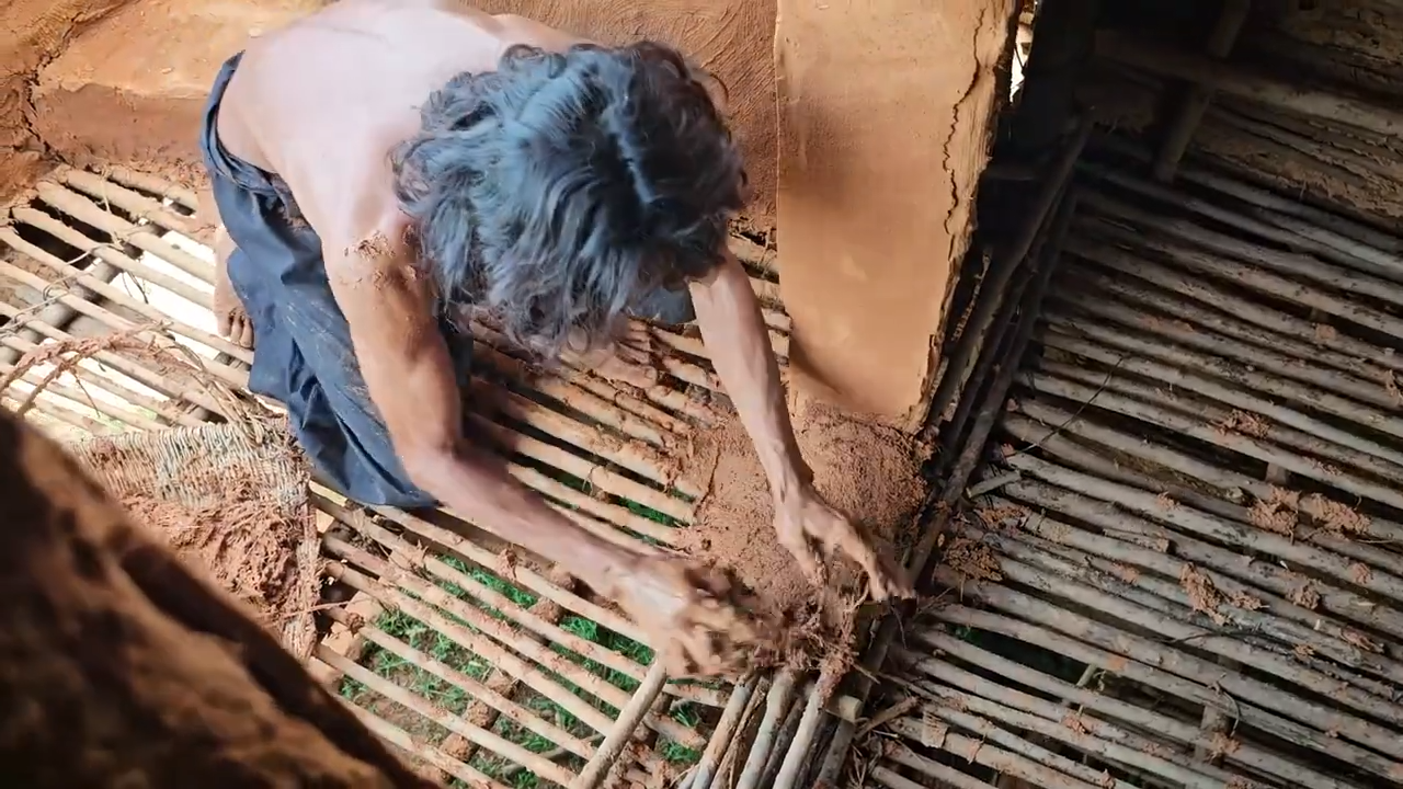 Building a forest shelter from mud and bamboo, and the structure nearly ...