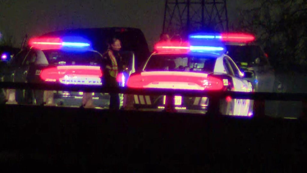 Two Dallas police officers injured while responding to a crash after ...