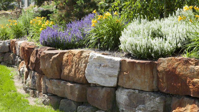 Tips for building a stone retaining wall in your garden on a budget