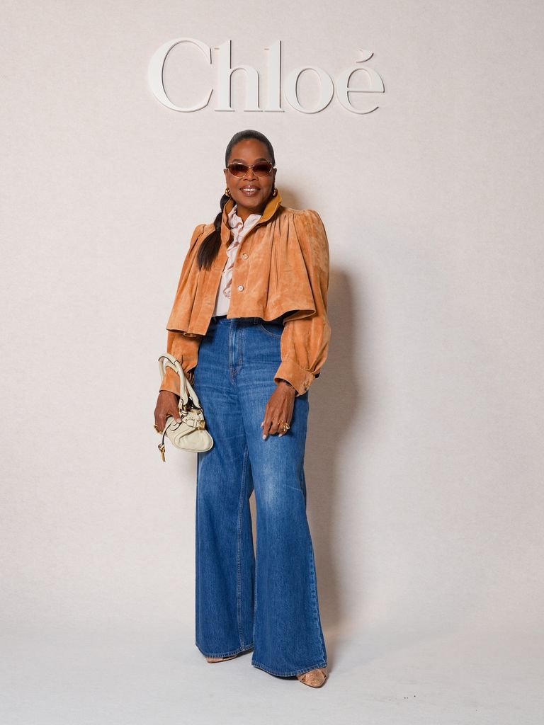 Oprah Winfrey highlights slim waist as she embraces her favorite ...