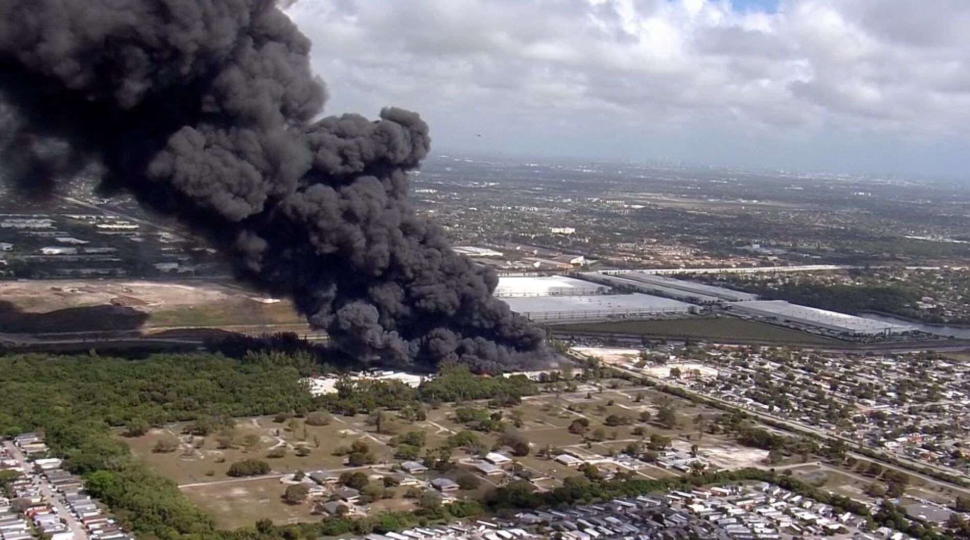 Four-alarm warehouse fire burns near Florida Turnpike in Northwest ...