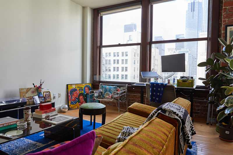 This small studio uses "soft zoning" to feel like multiple rooms
