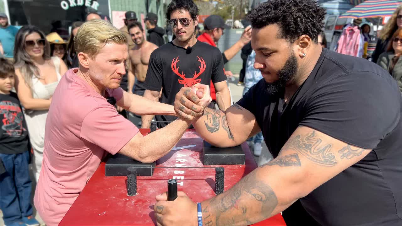 What happens when a professional arm wrestler faces random people