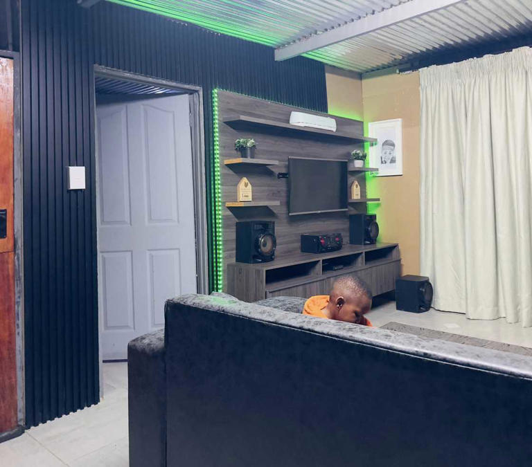 Gauteng man’s shack with LED panels, mounted TV and a garage has SA ...