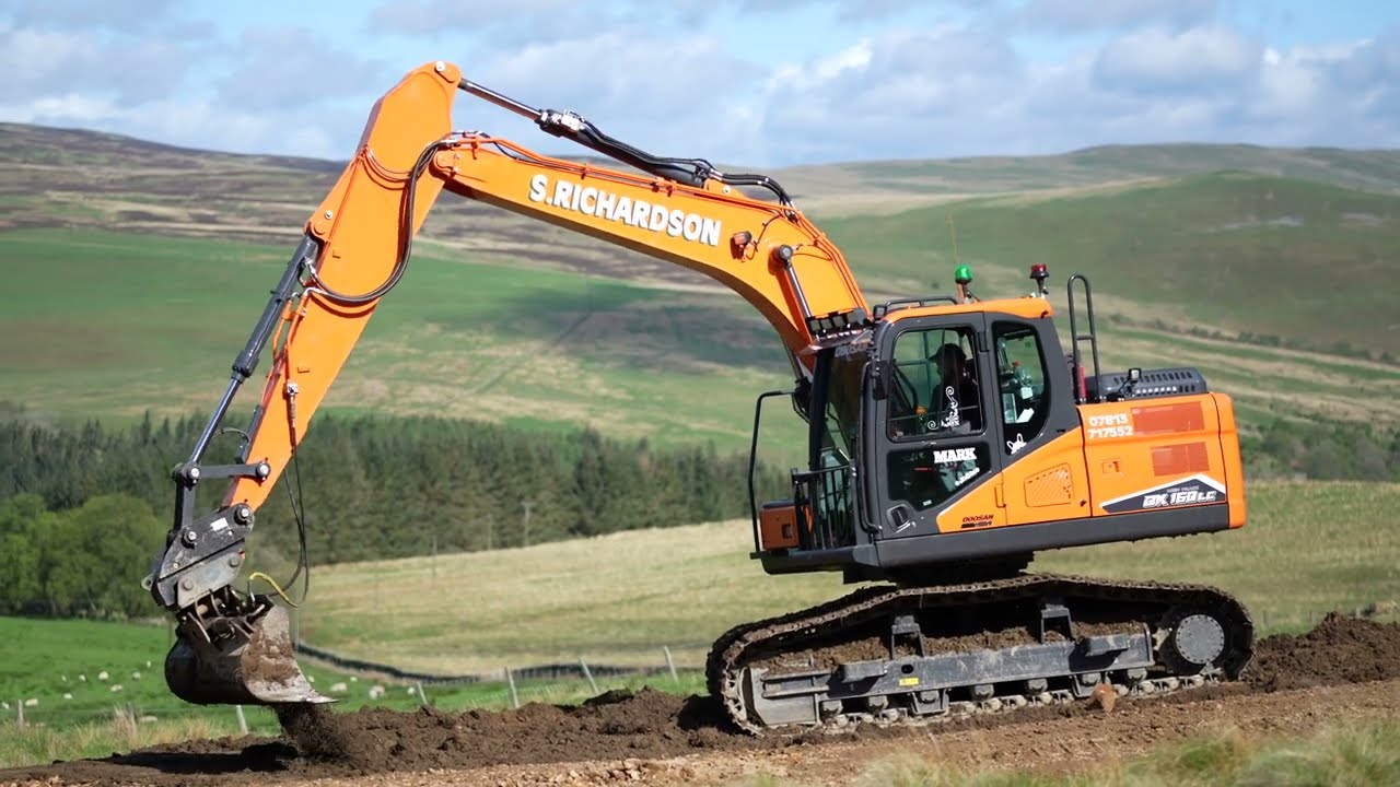 Massive Doosan excavator shaping rural terrain