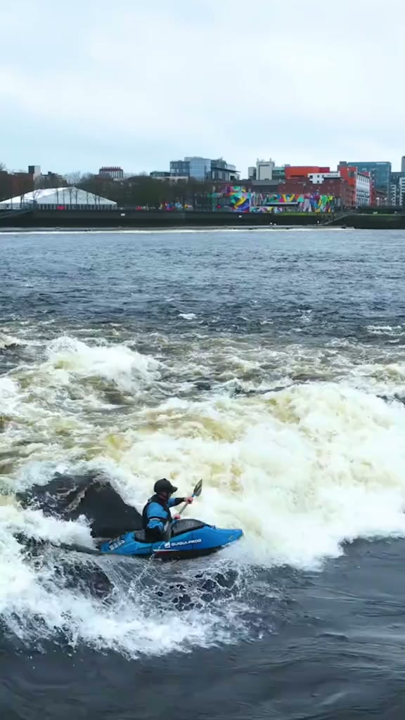 Surfing Limericks river wave in a kayak