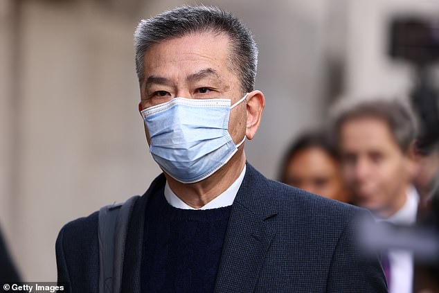 Moment Chinese spies in UK 'pour water under kidnap target's door in ...