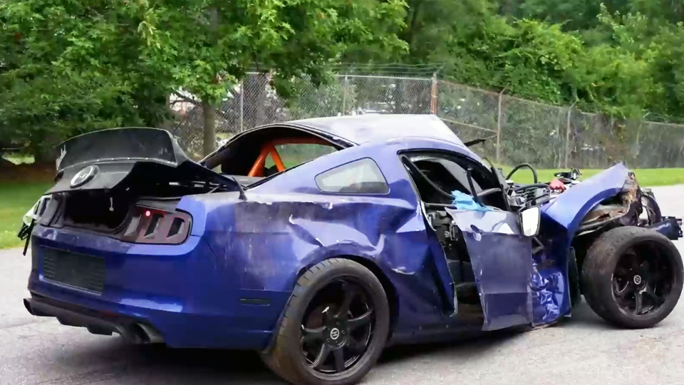 A destroyed Mustang with valuable mods