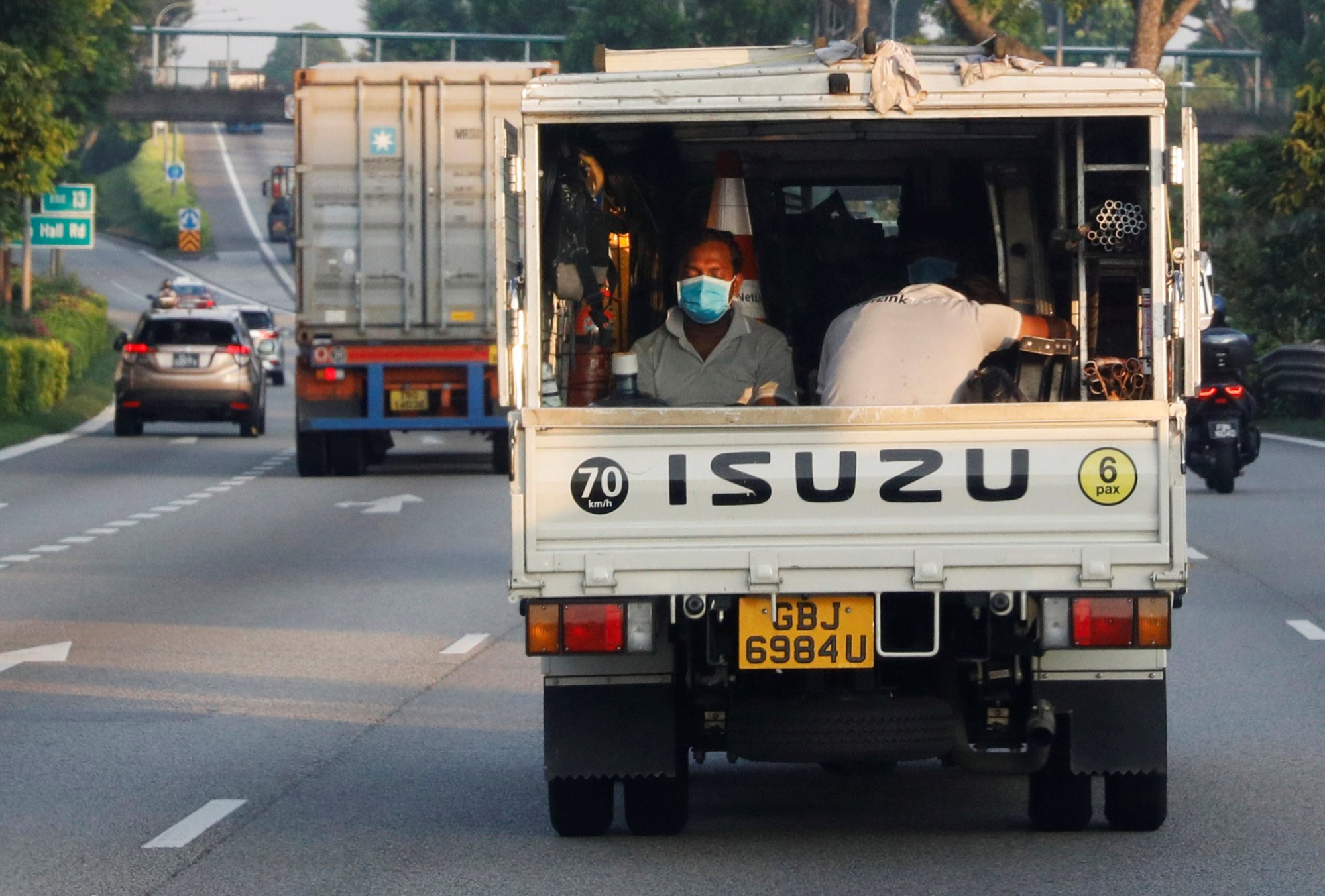 Singapore’s ban on caged lorries revives debate over migrant worker ...