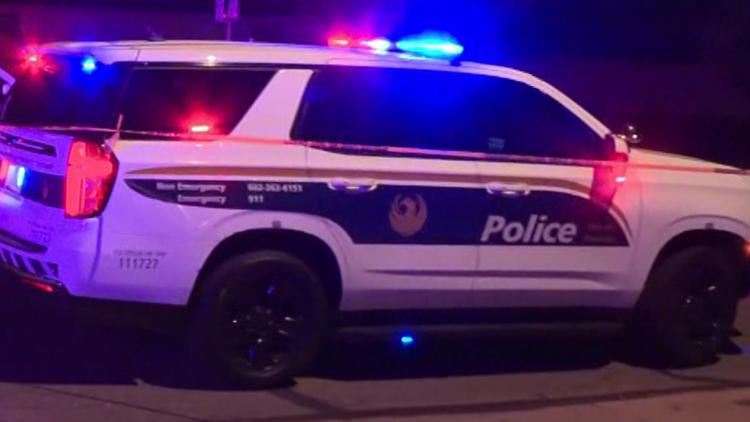 1 detained after man found shot dead in truck in north Phoenix
