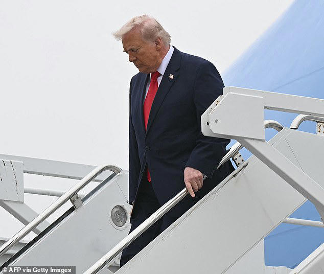President Donald Trump salutes coffins of six fallen soldiers killed in ...
