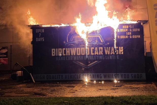 Hand car wash engulfed in flames as fire breaks out in storage container
