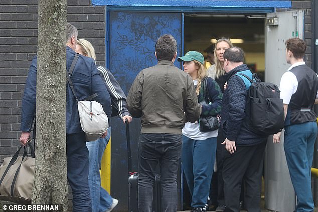 Noel Gallagher and Tori Cook sneak out of Euston Station side exit ...