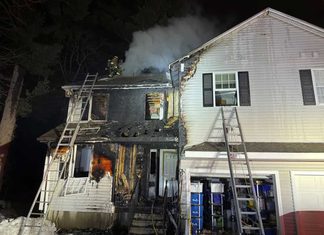 Sprinkler system helps contain townhouse fire, officials say