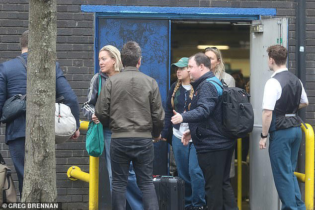 Noel Gallagher and Tori Cook sneak out of Euston Station side exit ...