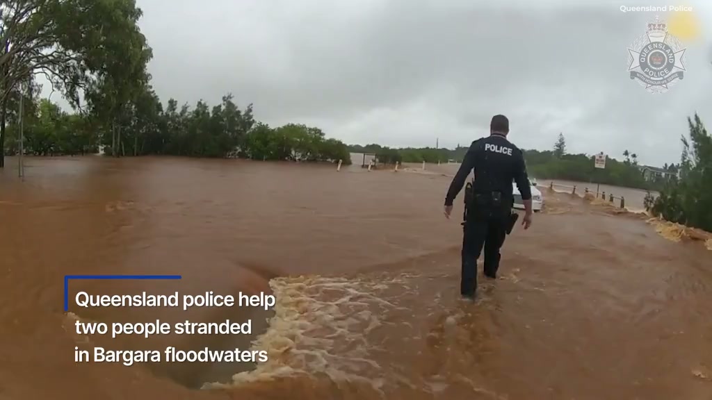 QLD police assist two people stranded in Bargara floodwaters