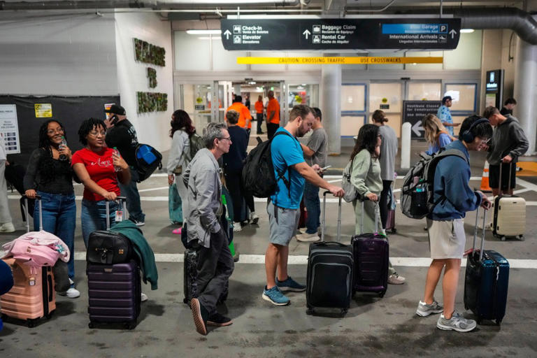 Fuming travelers wait in airport security lines for hours due to TSA ...