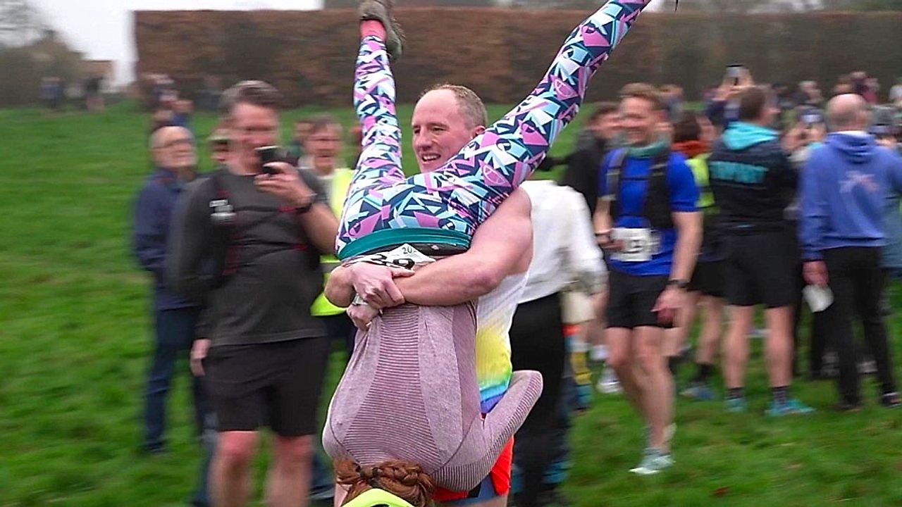 Couples sprint uphill in quirky UK wife-carrying race