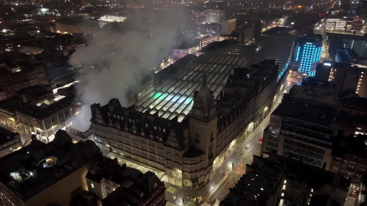 Drone footage shows collapsed building on fire as trains cancelled to ...