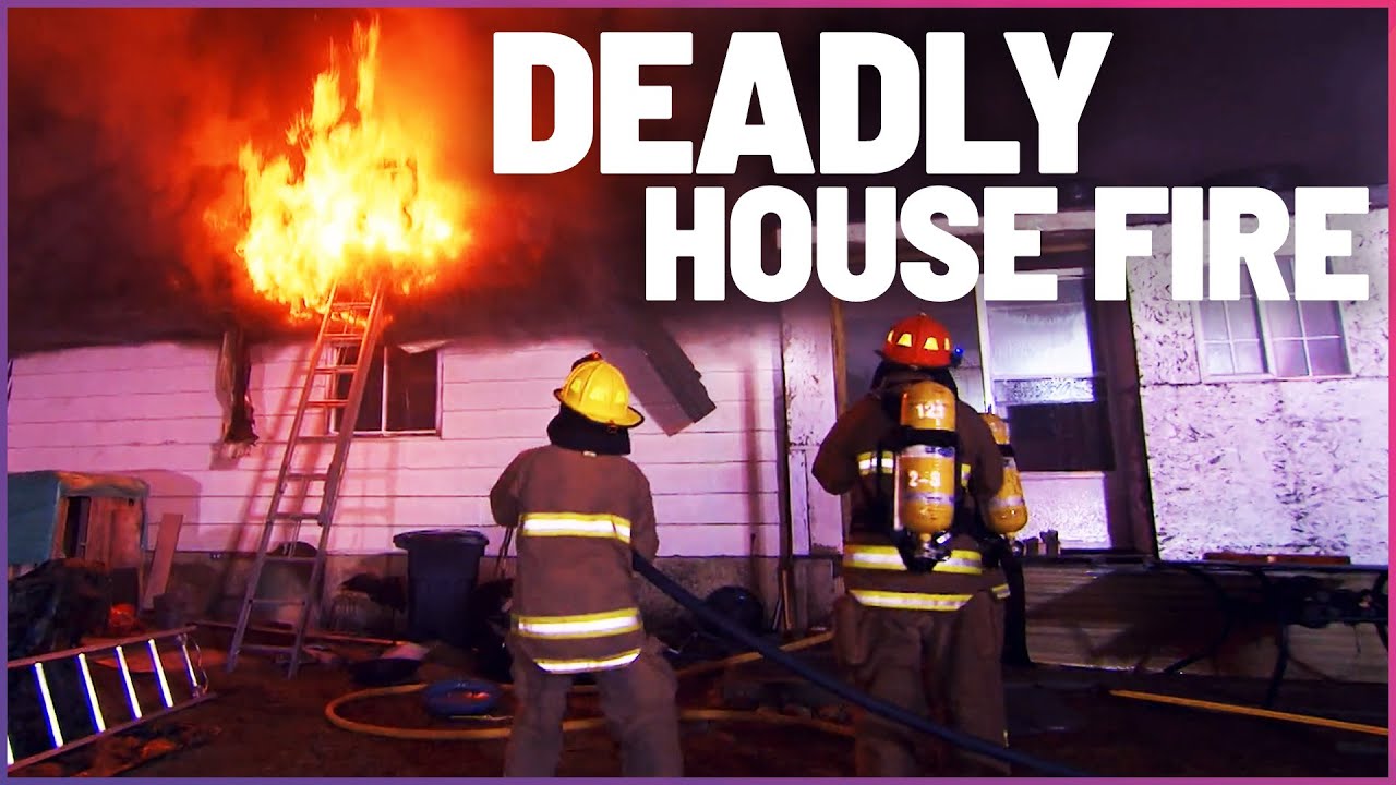 Emergency firefighters respond to an out-of-control house fire ...