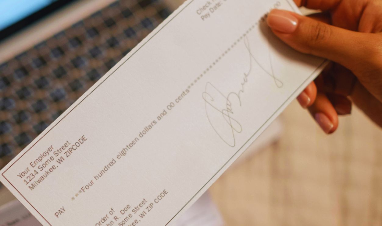 I deposited a check, but my bank held the money for 9 days, past when ...