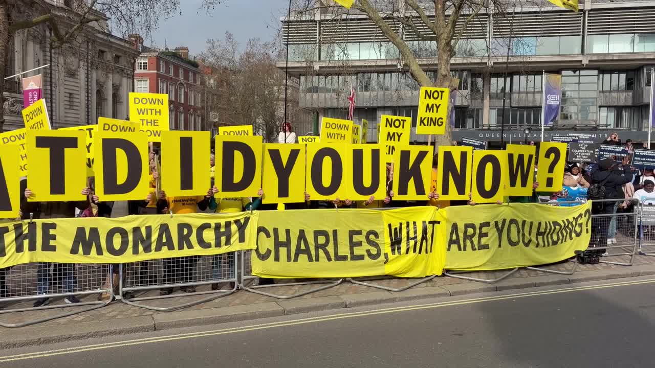 Anti-monarchy group Republic hold signs spelling out ‘What did you know ...