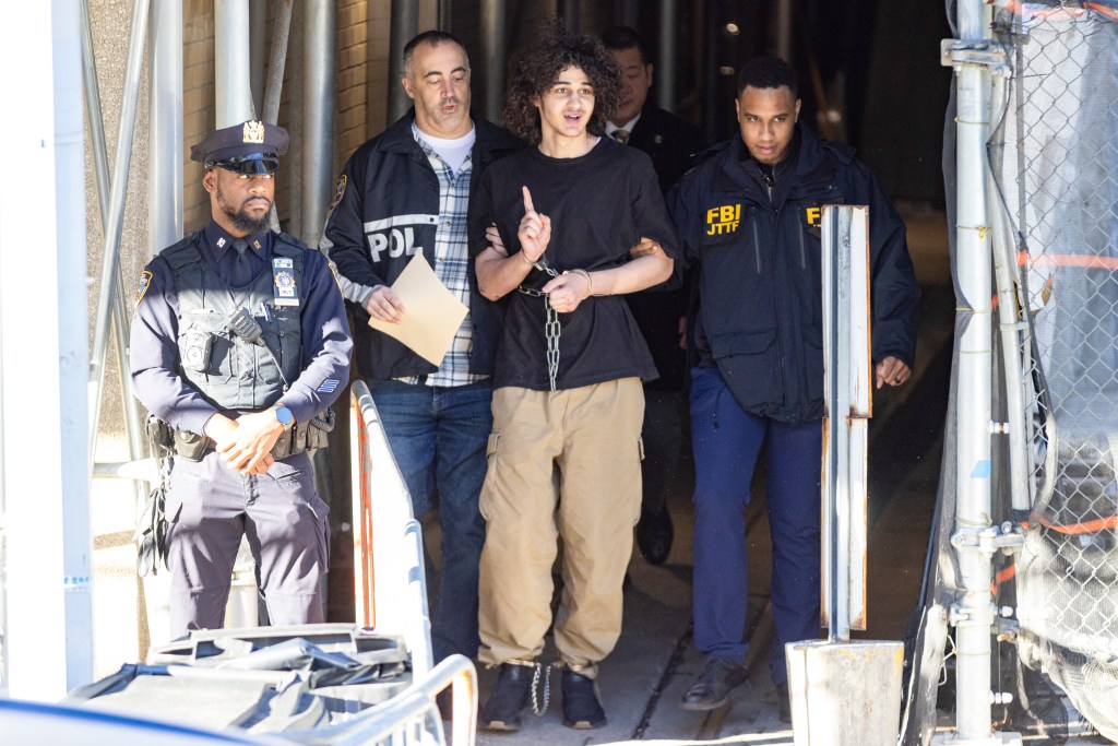 Suspected terrorist defiantly flashes ISIS salute after he's busted for ...