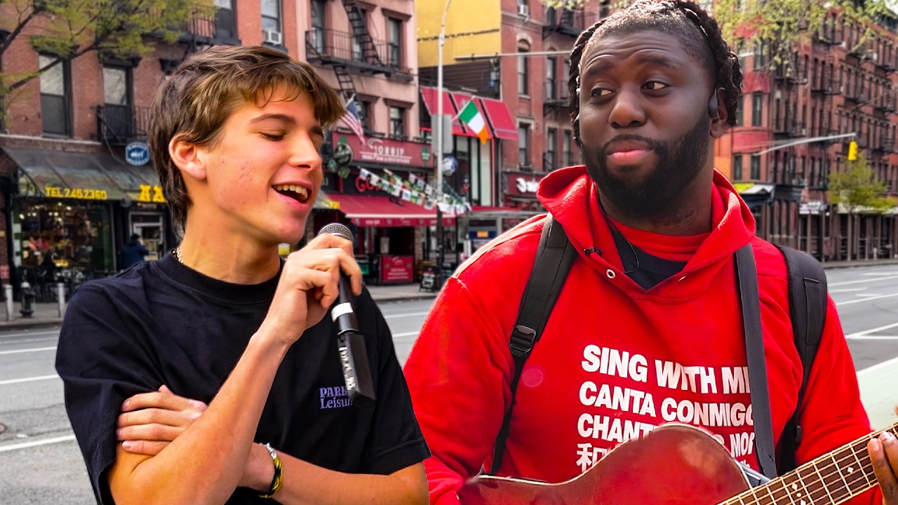 Proud family watches their son sing on the street