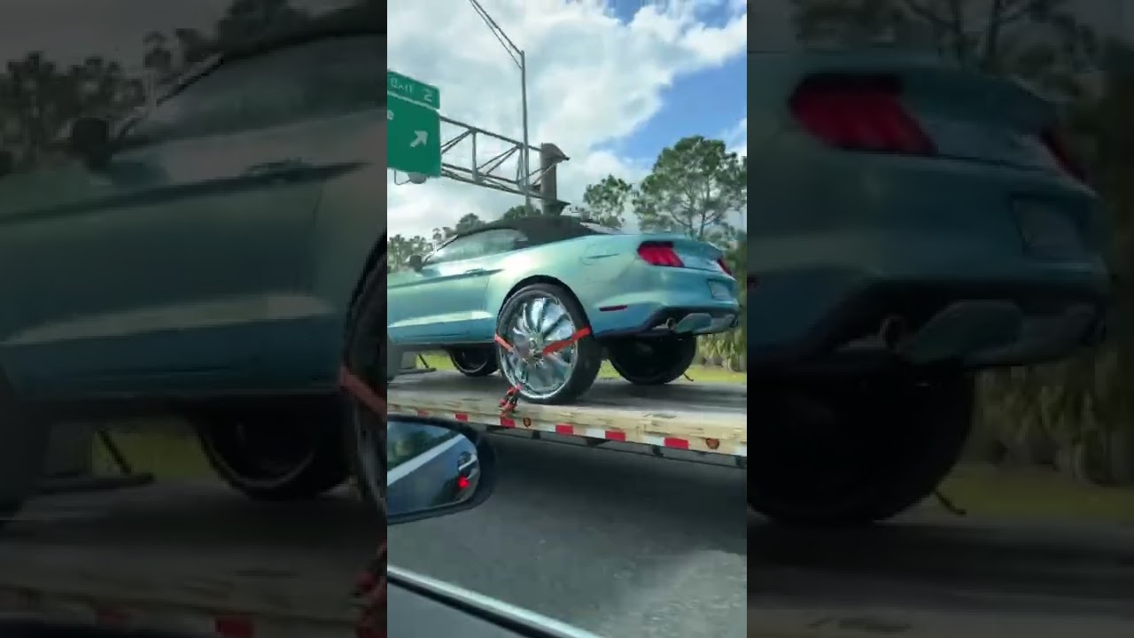 Hotshot transporting Mustang on 32’s floaters and BMW on 30s