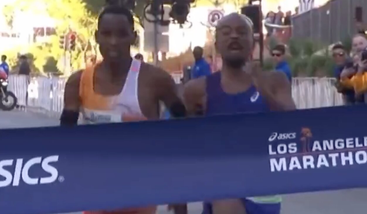 Watch: American runner chases down leader of LA Marathon to win by ...