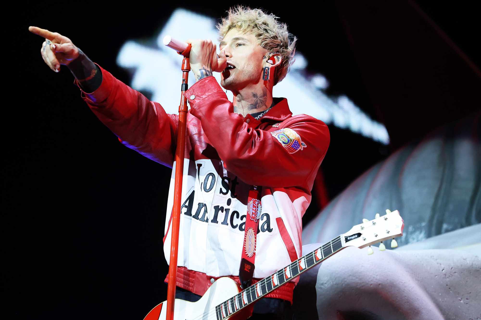 MGK reacts as fan falls through a hole in the stage at his London show ...